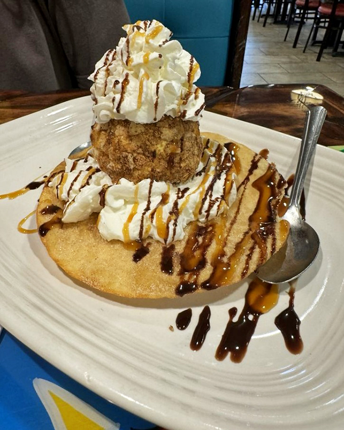 Fried ice cream that defies physics&mdash;hot, crispy exterior protecting cold, creamy interior. It's science and art on a plate, drizzled with chocolate and caramel.