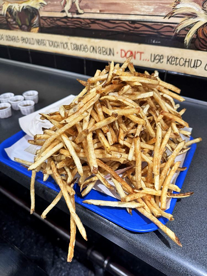 Golden fries arrive hot and crispy, proving that some side dishes deserve to be stars in their own right.