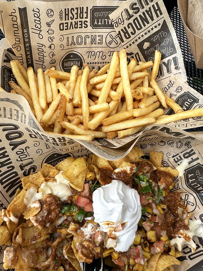 The ultimate friendship: golden fries standing tall beside a Frito pie that's having an identity crisis as a nacho platter.