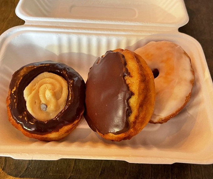 Three perfect chocolate-dipped specimens alongside their glazed companions. The kind of donut box that makes you the office hero or family favorite.