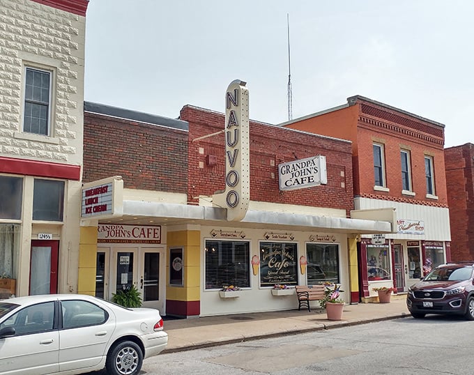 Grandpa John's Cafe serves up small-town hospitality with a side of nostalgia under that classic vertical "NAUVOO" sign that's seen it all.
