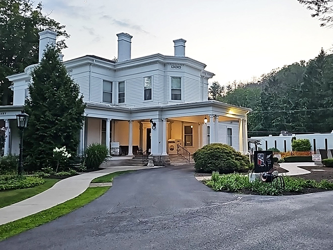 This elegant white Victorian building whispers stories of a time when libraries were community living rooms and WiFi meant "Why Find Inside?"