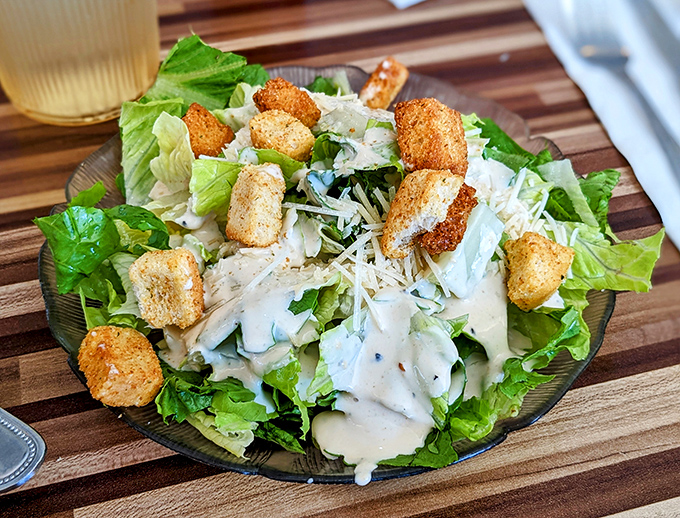 A Caesar salad that Julius himself would approve&mdash;crisp romaine, golden croutons, and dressing that strikes the perfect balance of creamy and tangy.