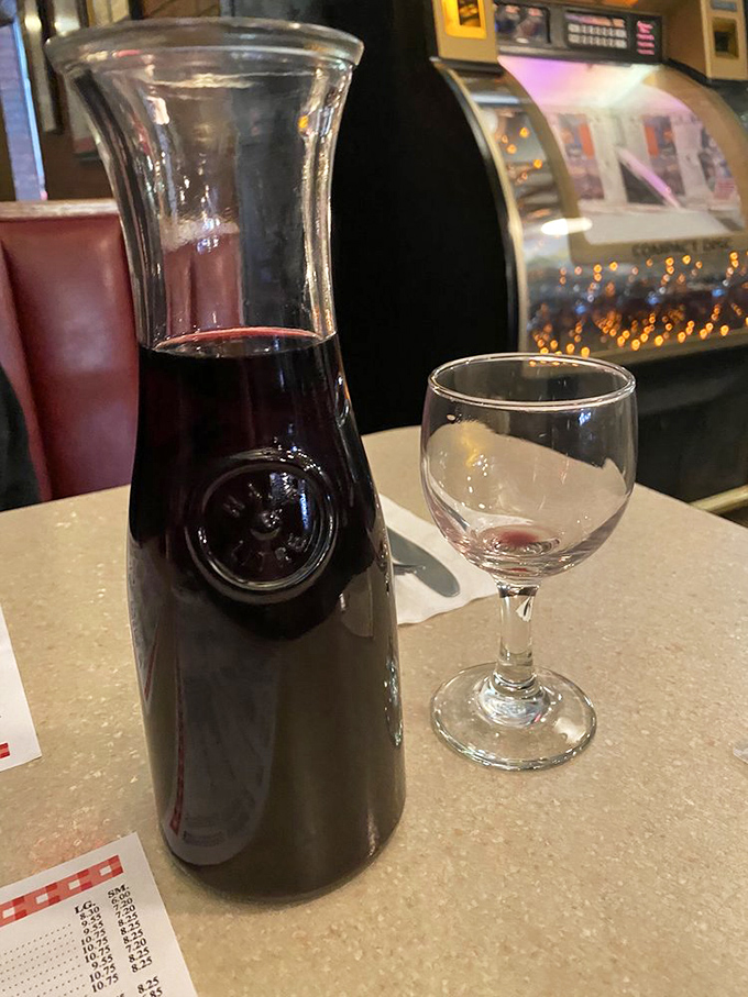 Wine served in carafes &ndash; because sometimes civilization means not having to do math to figure out how many glasses you've had.