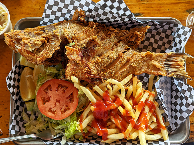 The whole hogfish, fried to crispy perfection, stares back as if to say, "I'm worth every penny of that vacation budget."