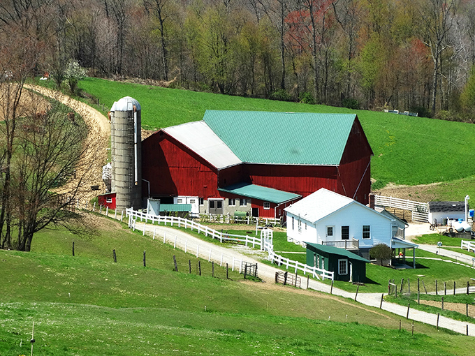 Red barn, white fence, green pastures—the classic American landscape painting comes to life in Holmes County's patchwork of family farms.
