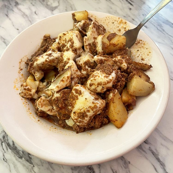 Breakfast potatoes that have achieved cult status among locals&mdash;crispy edges, tender centers, and seasoning that makes you wonder, "What's their secret?"