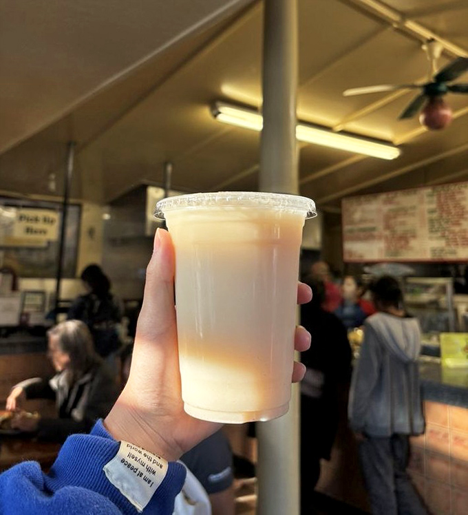 Horchata: the cinnamon-kissed rice milk that cools the fire and soothes the soul. Liquid comfort in a plastic cup.