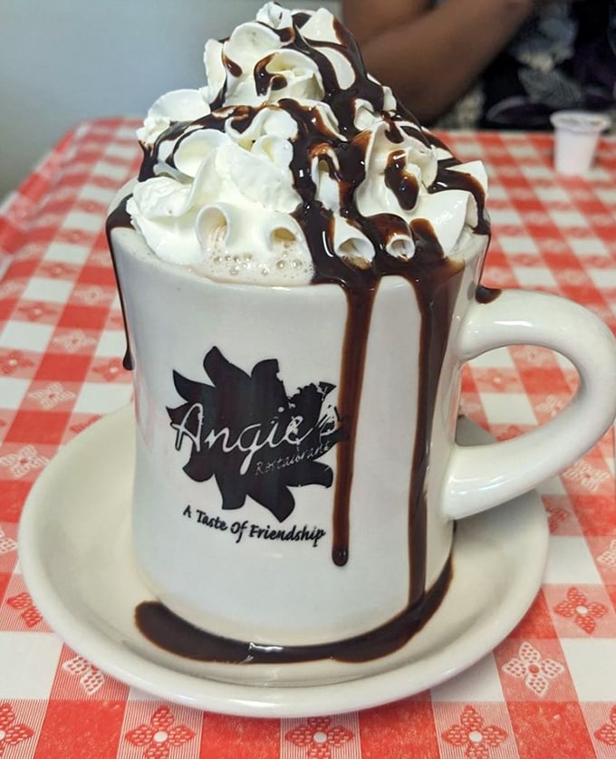 Hot chocolate that's dressed better than most people at formal events. That chocolate drizzle is basically edible fashion.