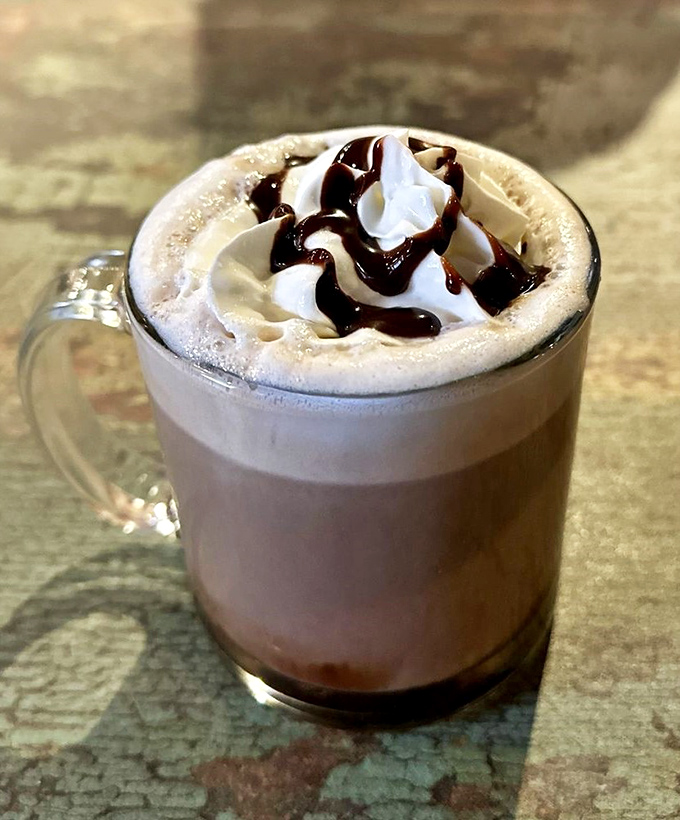 Not your average hot chocolate&mdash;this mug of liquid comfort topped with whipped cream and chocolate drizzle is basically dessert with a caffeine permit.