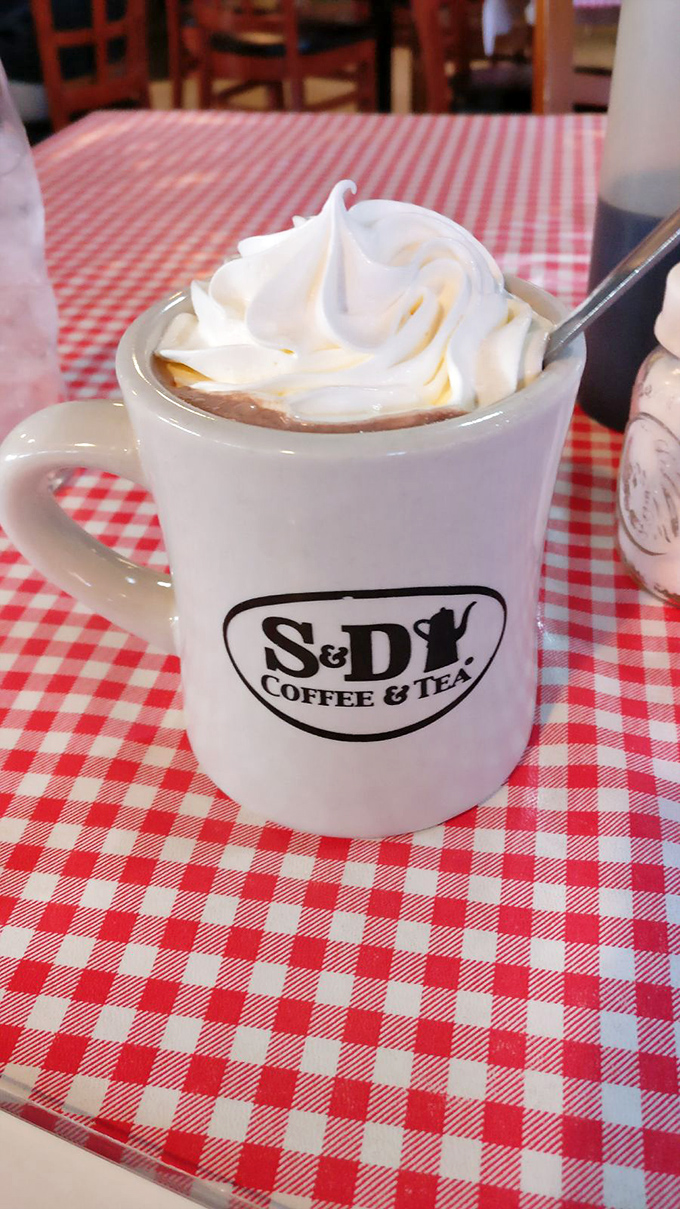 Hot chocolate that doesn't mess around&mdash;topped with a cloud of whipped cream in a mug that's seen decades of satisfied sippers.