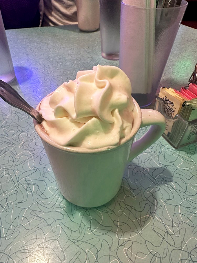 Not your average hot chocolate&mdash;this towering cloud of whipped cream transforms a simple beverage into a dessert-worthy experience worth lingering over.