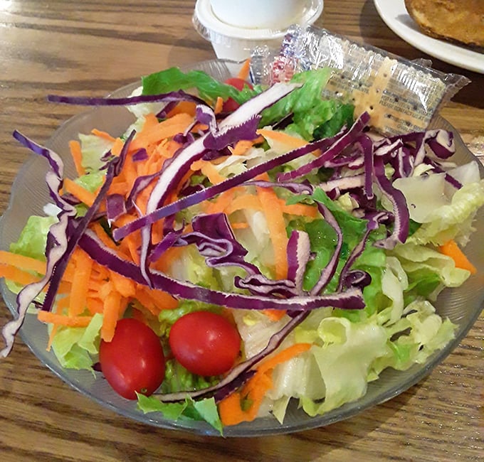 Fresh, vibrant salad that doesn't apologize for being healthy amid indulgence. Those cherry tomatoes pop like flavor fireworks.