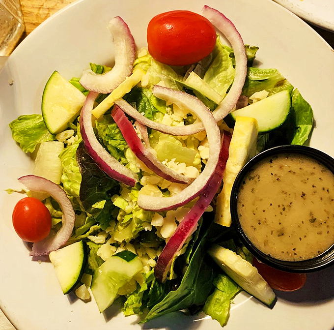 A garden-fresh house salad that's anything but an afterthought – crisp vegetables, vibrant colors, and a house-made dressing that makes eating your greens a pleasure.