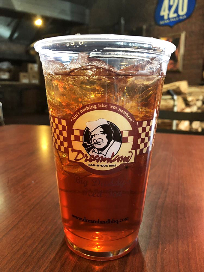 Sweet tea served in a cup that proudly declares "Ain't nothing like 'em nowhere." In the South, this isn't just a beverage—it's practically a constitutional right.