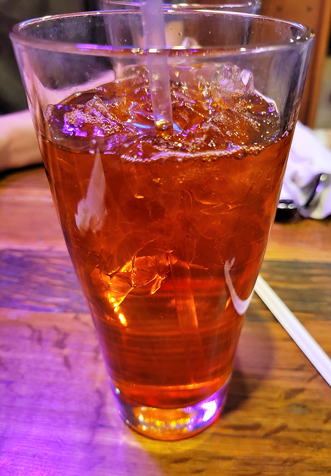 The Thai iced tea glows with amber promise&mdash;sweet, strong, and the perfect firefighter for taste buds that ventured too far into spice territory.