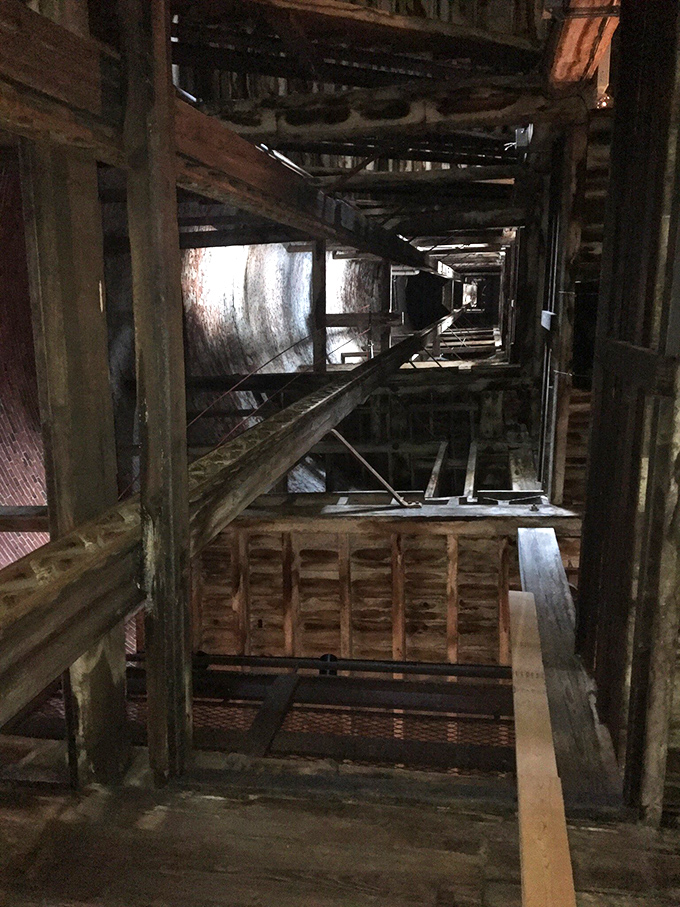 Looking up through the tower's wooden skeleton is like peering into industrial archaeology&mdash;where molten lead once fell, tourists now gaze in wonder.