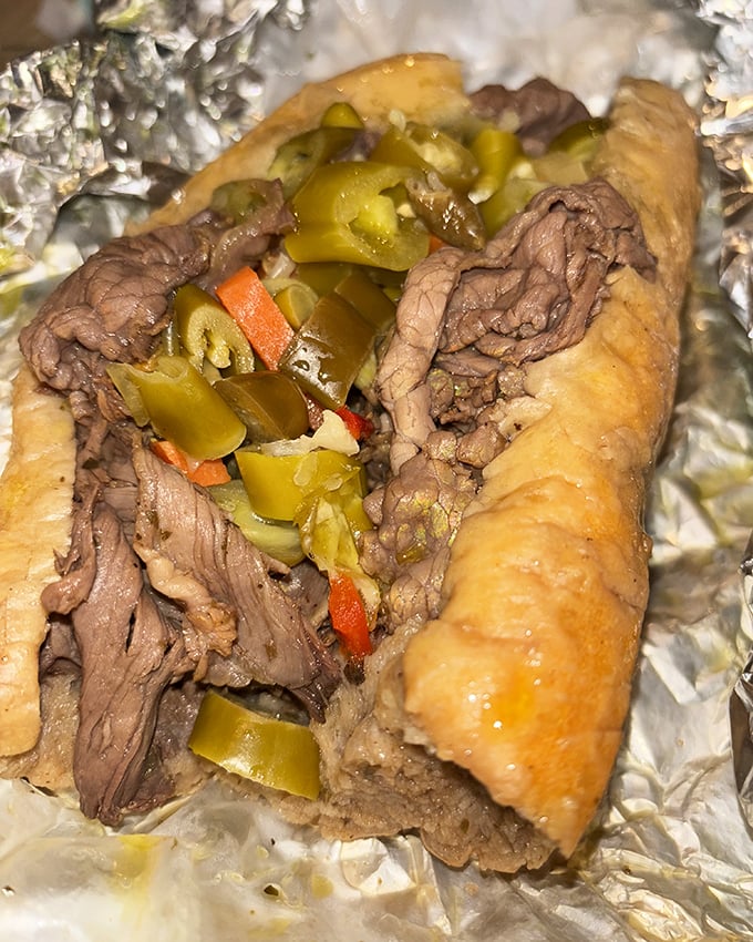 The Italian beef sandwich, Chicago's other culinary masterpiece, dressed with giardiniera that adds just enough kick to wake up your senses.