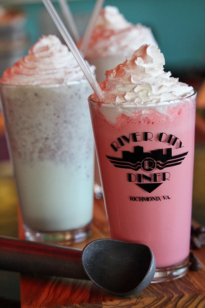 Milkshakes so thick they defy gravity and challenge straws to a duel. The whipped cream mountain on top is a dairy dreamscape.