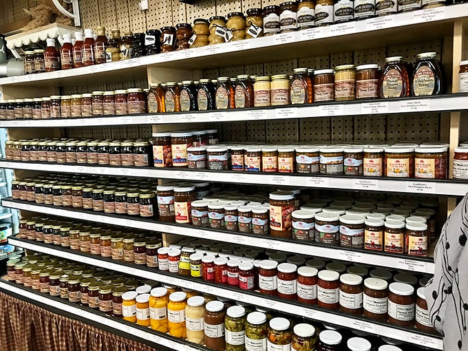 This wall of jams and pickles isn't just preserved food&mdash;it's preserved tradition. Each jar contains summer sunshine waiting to brighten winter toast.