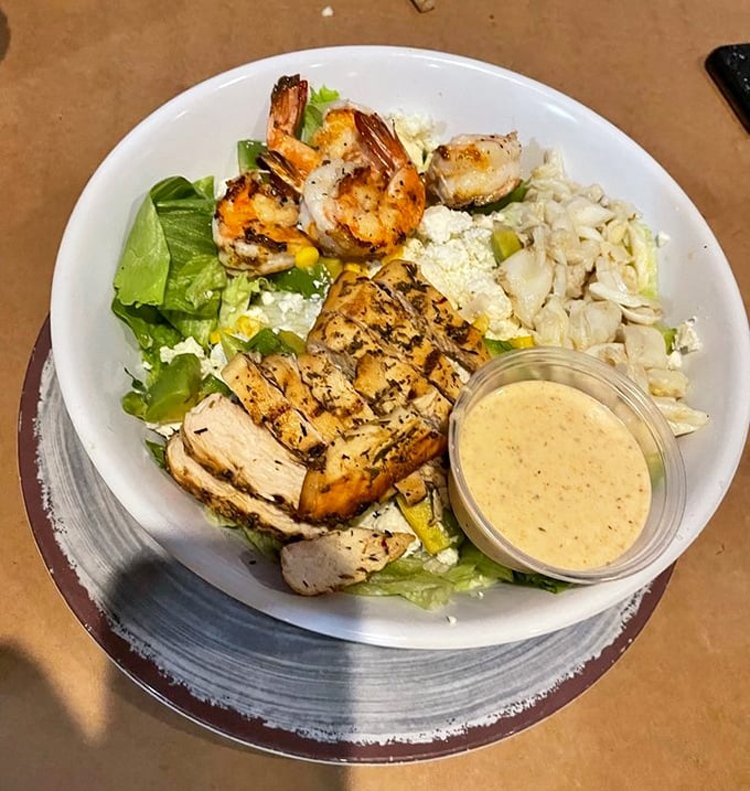 Grilled chicken and fresh greens create a salad that actually makes you forget it's technically healthy.