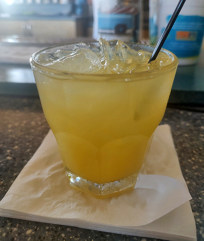 Nothing cuts through barbecue richness like a cold, refreshing beverage. This golden elixir is the perfect palate reset between bites of smoky goodness.