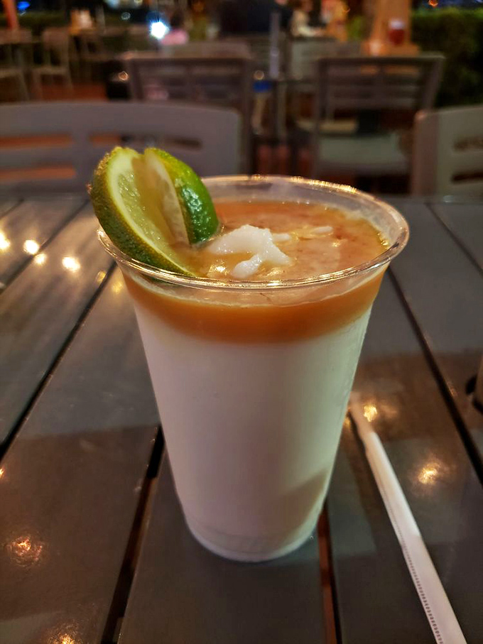 This layered cocktail isn't just Instagram-worthy&mdash;it's a tropical vacation in a glass. The lime isn't garnish; it's an essential character in this beachy drama.