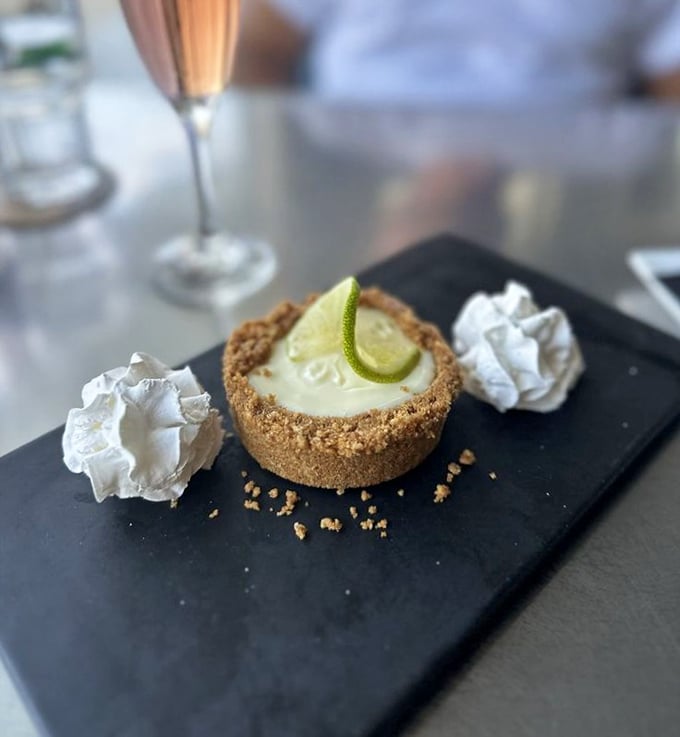 Key lime pie that makes you understand why people fight over the last slice. That graham cracker crust deserves its own fan club.