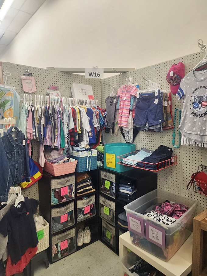 Organized chaos in the children's corner, where outgrown clothes find new life and parents find relief for their rapidly expanding kids.