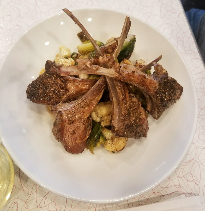 Lamb chops standing at attention like delicious sentinels guarding the vegetables beneath&mdash;a dish worth crossing state lines for.