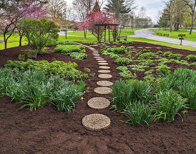Garden stepping stones lead visitors through a symphony of spring colors. Even non-gardeners will appreciate this meticulously designed floral showcase.