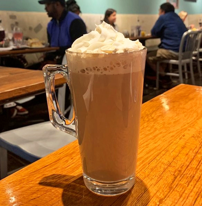 That's not just a latte&mdash;it's a frothy tower of caffeinated bliss, topped with enough whipped cream to make Monday mornings bearable.