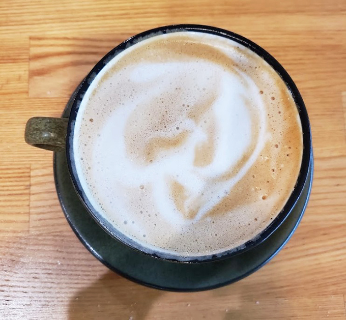 Coffee art so pretty you almost don't want to drink it. Almost. The morning struggle between appreciation and caffeine need is real.