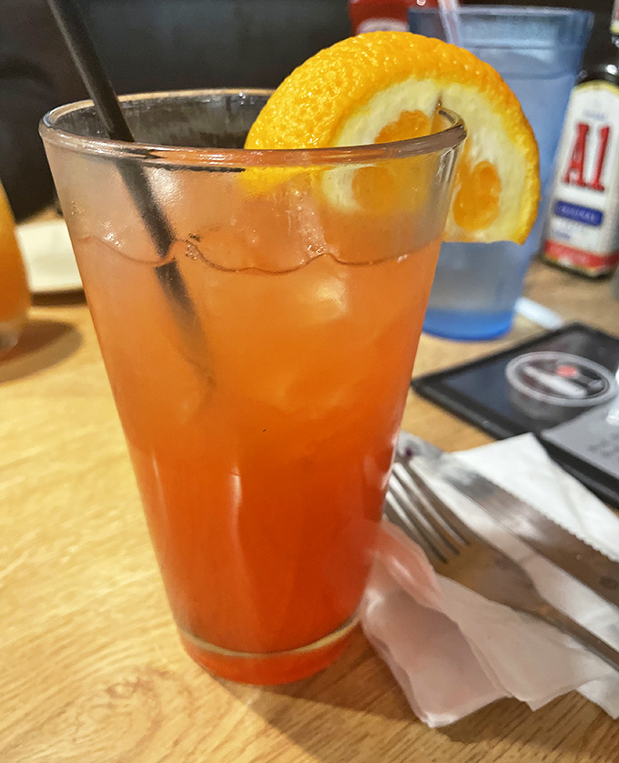 A proper steakhouse cocktail: bright, strong, and garnished with fresh orange. The perfect companion while waiting for your sizzling main event.