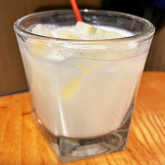 A frosty glass of what appears to be limoncello or a creamy cocktail&mdash;the perfect palate cleanser between bites or excuse to linger longer at your table.