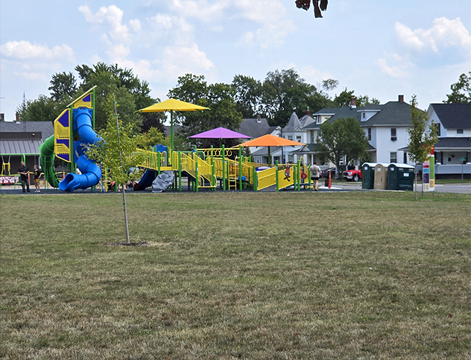 Childhood summers condensed into primary colors and playground equipment. The sound of kids laughing never changes, even when the slides get fancier.