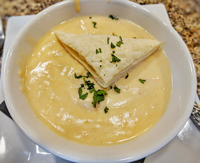 Creamy lobster bisque topped with delicate pastry proves that some classics never go out of style.