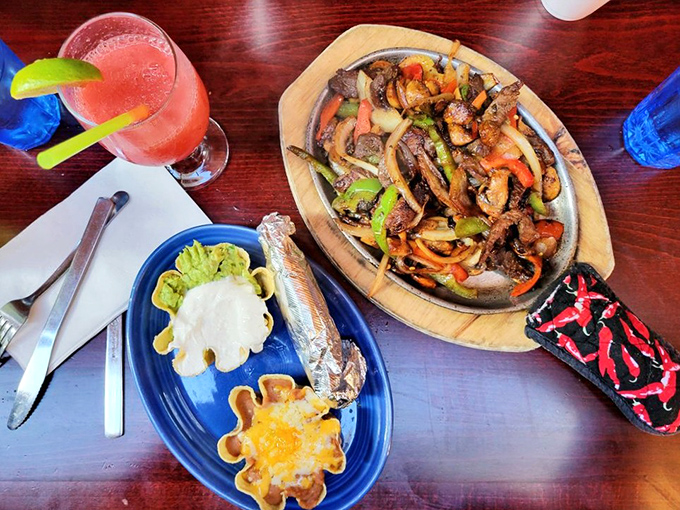 Fajitas that announce themselves with a sizzle before you even see them. That colorful wooden platter is practically a runway for beef stardom.