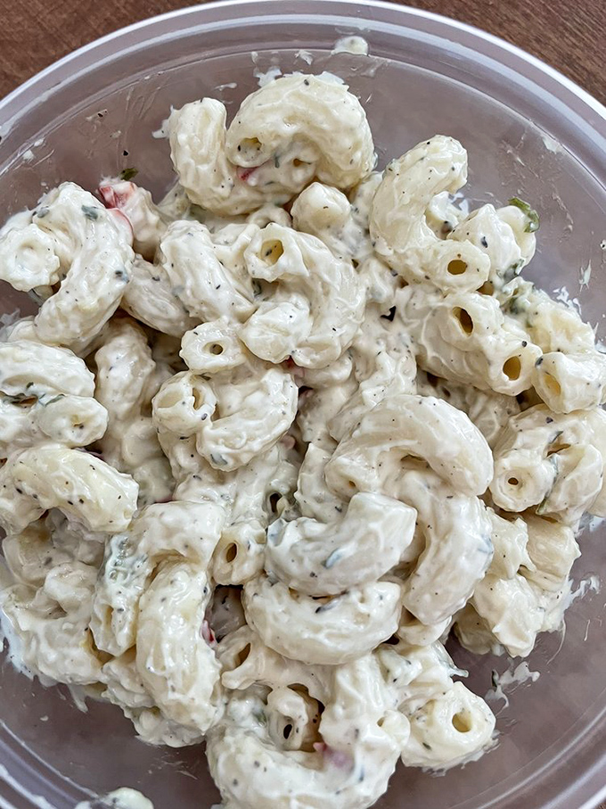 This macaroni salad isn't messing around. Creamy, perfectly seasoned, and substantial enough to be a meal itself if you weren't already in sandwich heaven.