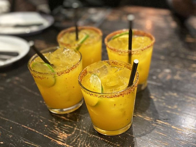 Mango margaritas with chili-salt rims – because sometimes you need something bright and zippy to cut through all that magnificent meat.