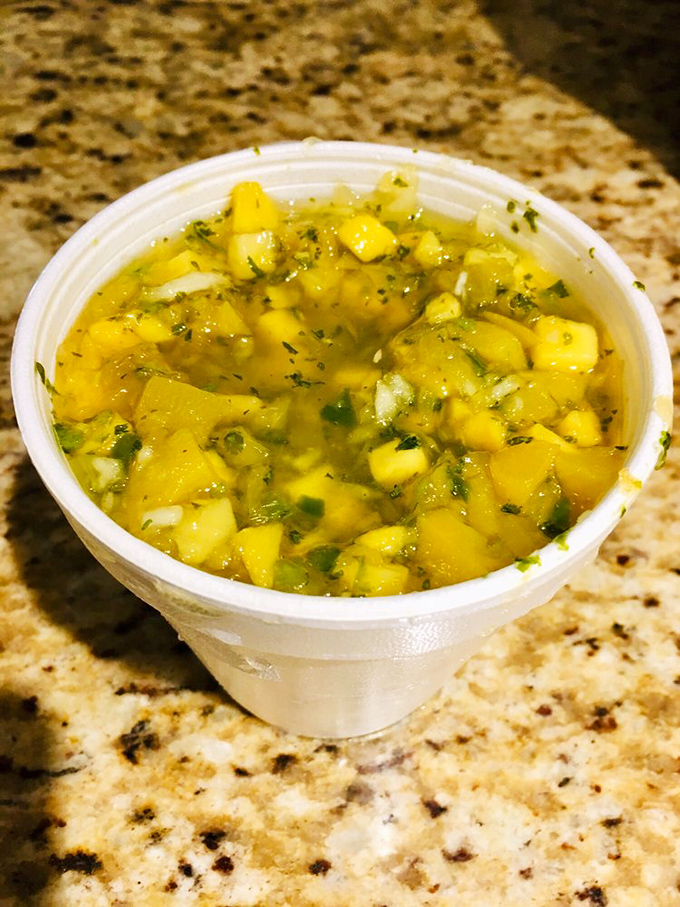 Sunshine in a cup. This mango salsa brings tropical brightness that cuts through smoky meats like a well-timed joke at a tense dinner.