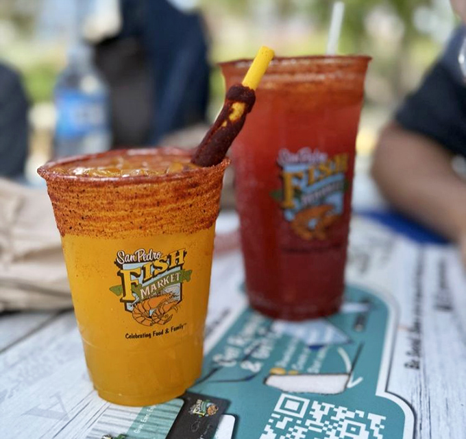 These vibrant micheladas aren't just drinks &ndash; they're liquid sunshine with a spicy kick that perfectly complements the seafood feast.