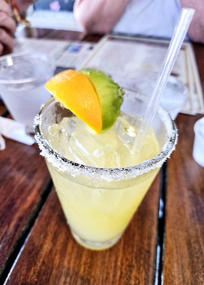 That salt-rimmed glass isn't just holding a margarita &ndash; it's containing liquid sunshine with a kick that whispers "vacation mode: activated."