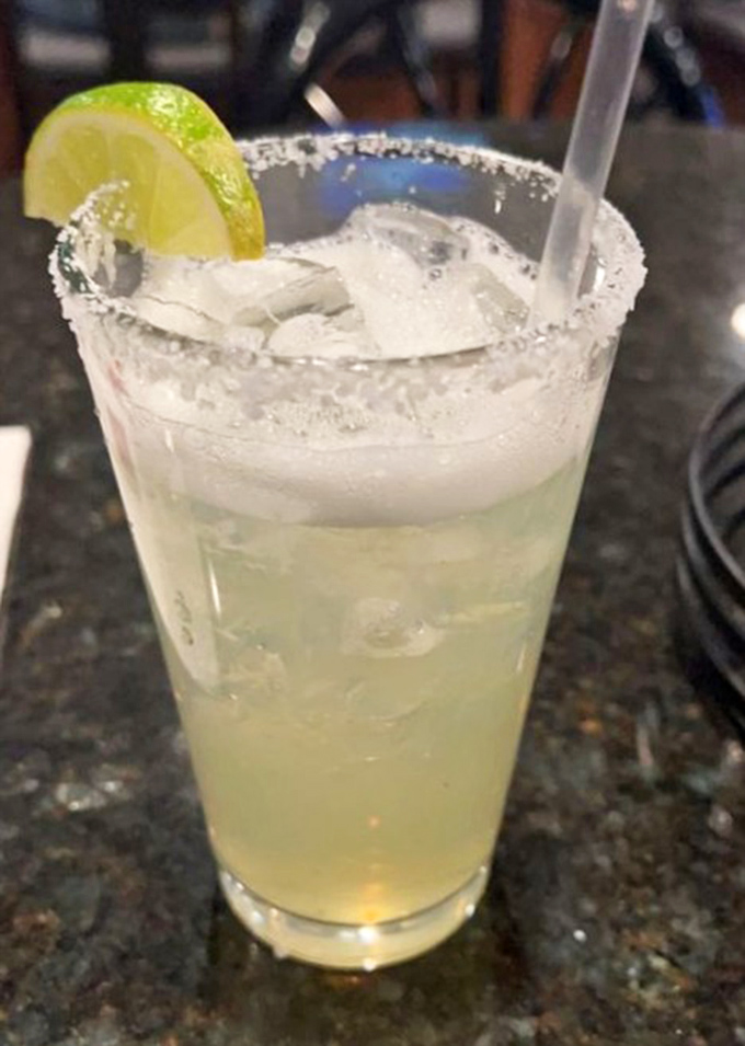 A margarita with salt rim that says, "The day is done, friend. You've earned this moment of lime-kissed tranquility."