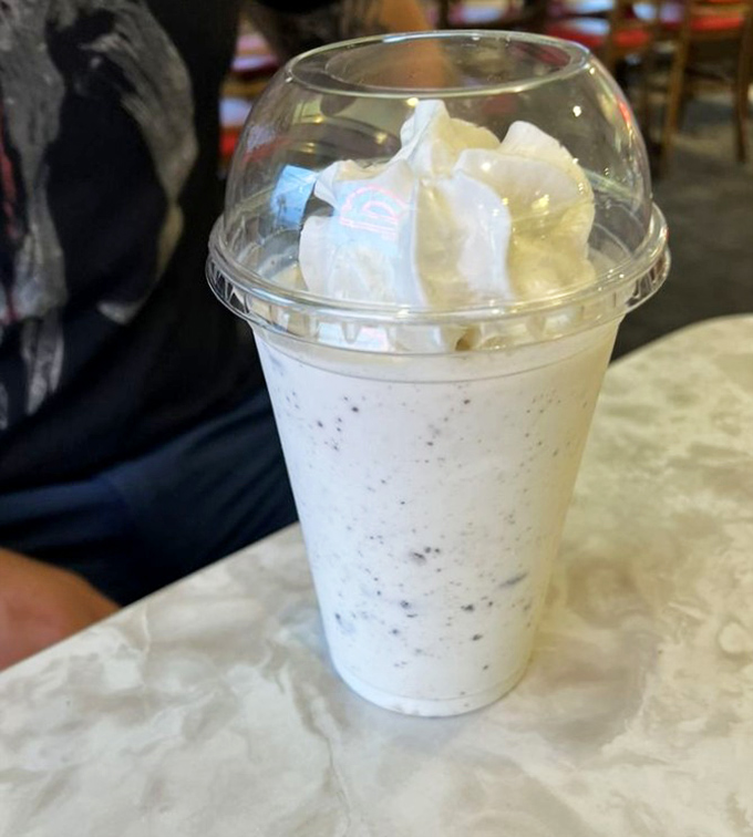 This isn't just a milkshake; it's a time machine to simpler days when happiness came in a tall glass with whipped cream on top.