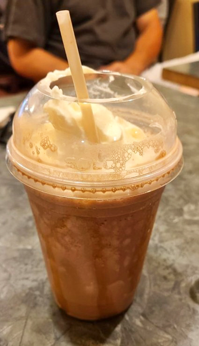 That milkshake brings all the joy to the yard. Topped with whipped cream, it's the perfect companion to pizza indulgence.