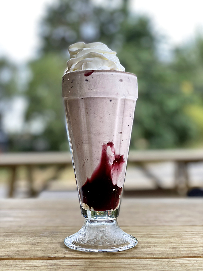 This isn't just a milkshake&mdash;it's a tower of creamy indulgence with berry swirls that make you question why you ever settled for anything less.