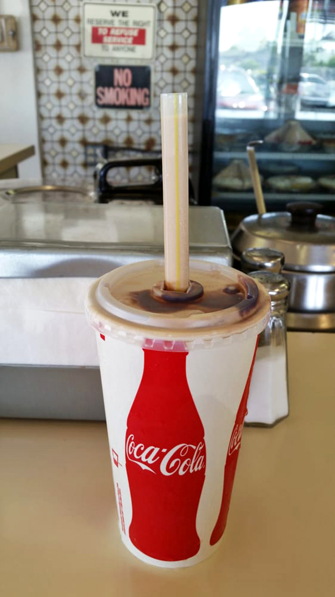 That classic Coca-Cola in a paper cup isn't just a drink&mdash;it's a time machine back to when simple pleasures were all we needed.