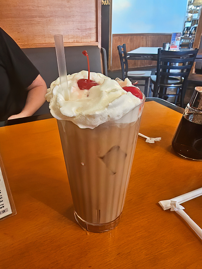 That's not just a milkshake – it's a towering monument to dairy devotion, complete with whipped cream and cherries on top.