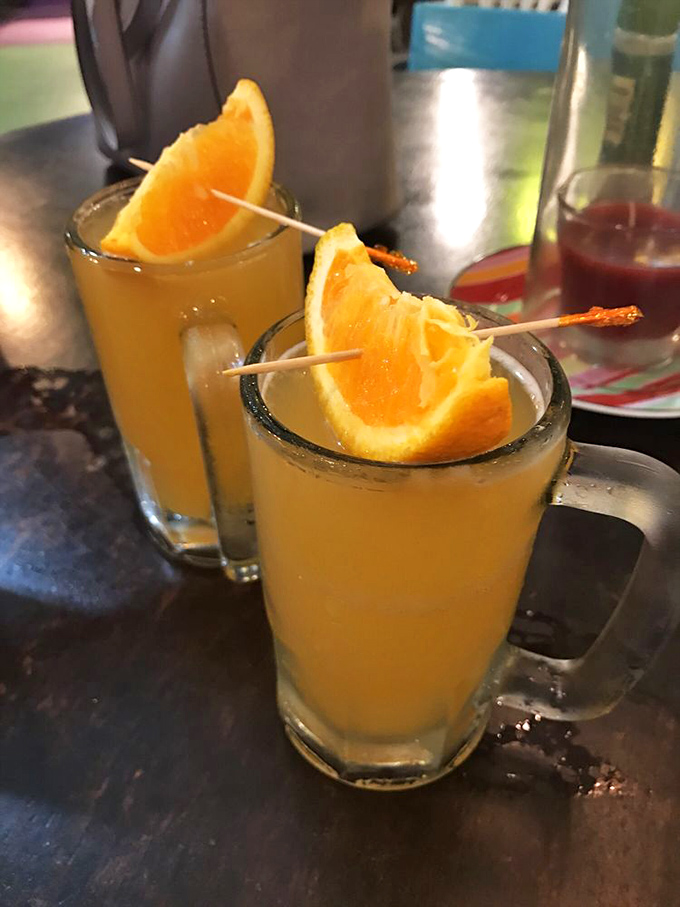 These mimosas aren't just drinks, they're liquid sunshine in glassware. That orange wedge is basically saying, "Yes, I'm fresh-squeezed and proud of it."